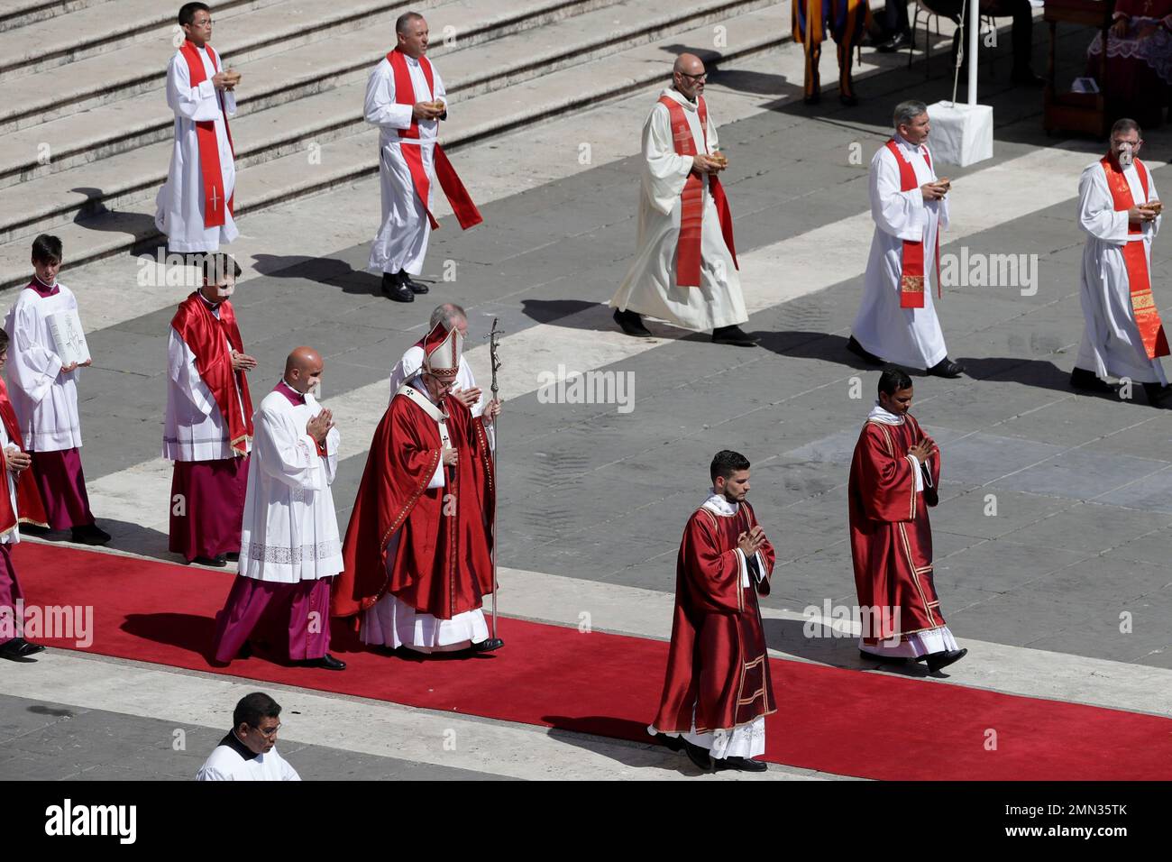 Pope Francis, center, holds his pastoral staff as he celebrates a Mass ...