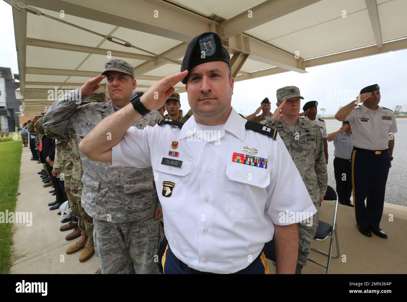 U.S. Army soldiers salute during an opening ceremony for the new ...