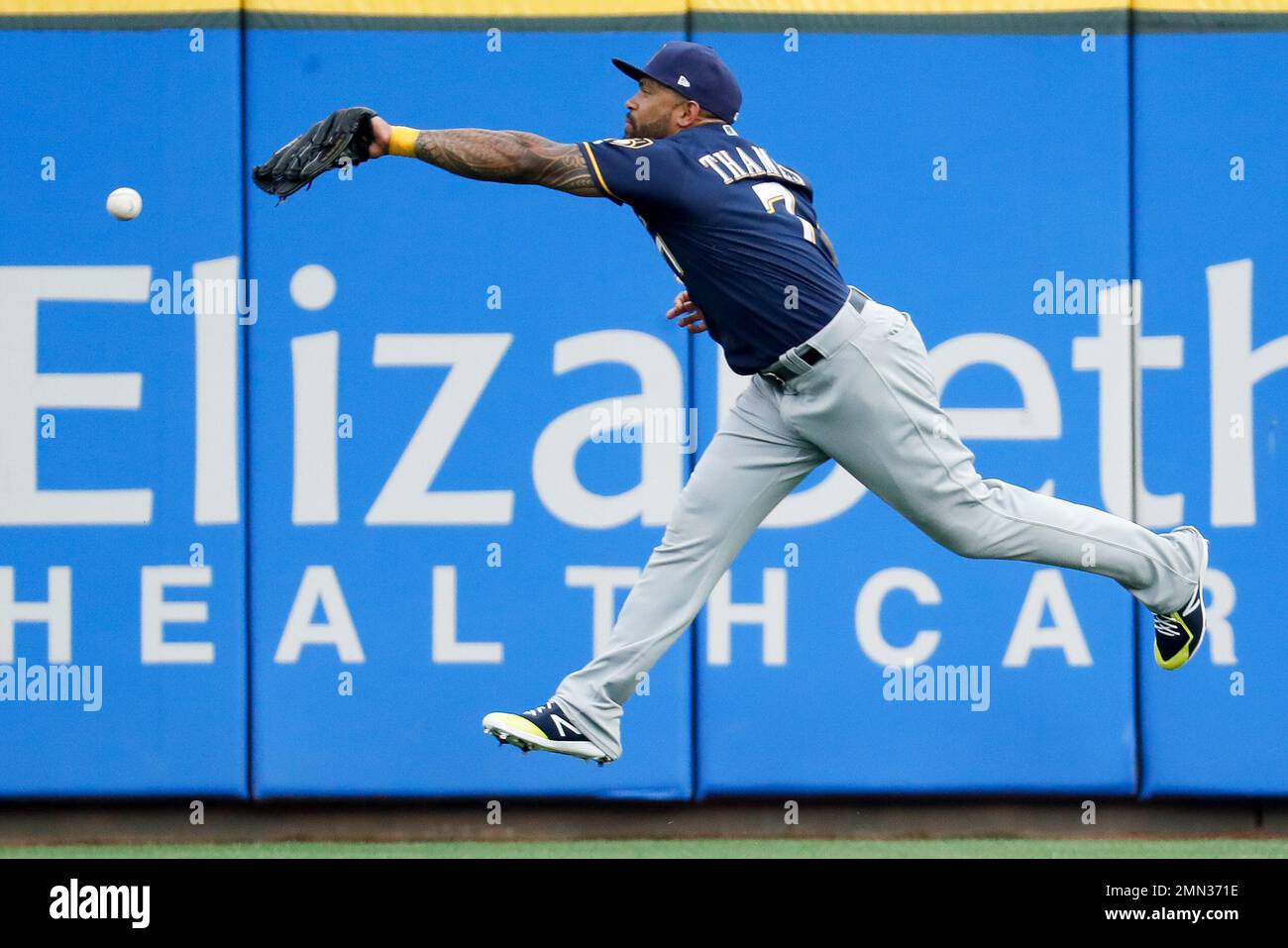 Milwaukee Brewers right fielder Eric Thames misses a double by ...