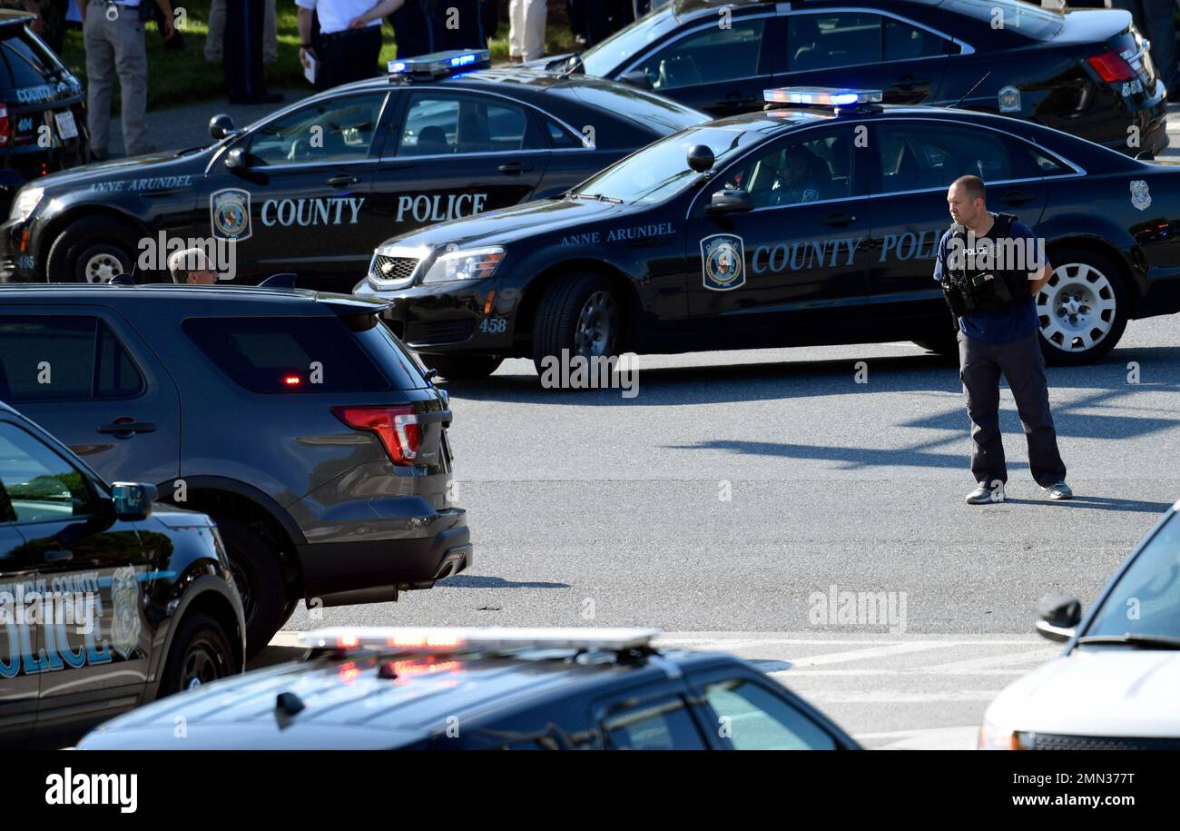 Police secure the scene of a shooting an office building housing The ...