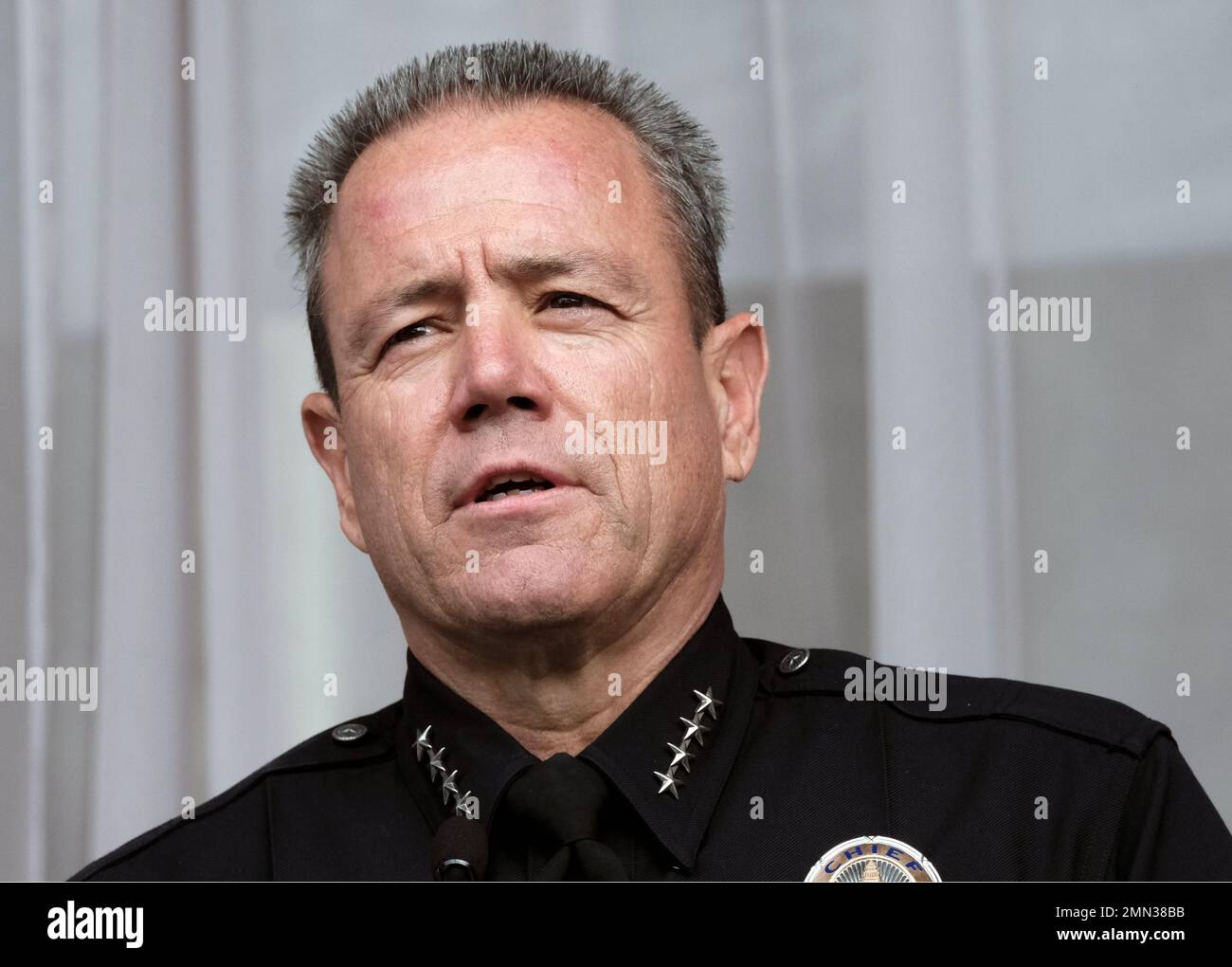 Los Angeles Police Chief Michael Moore talk after being sworn in at the ...