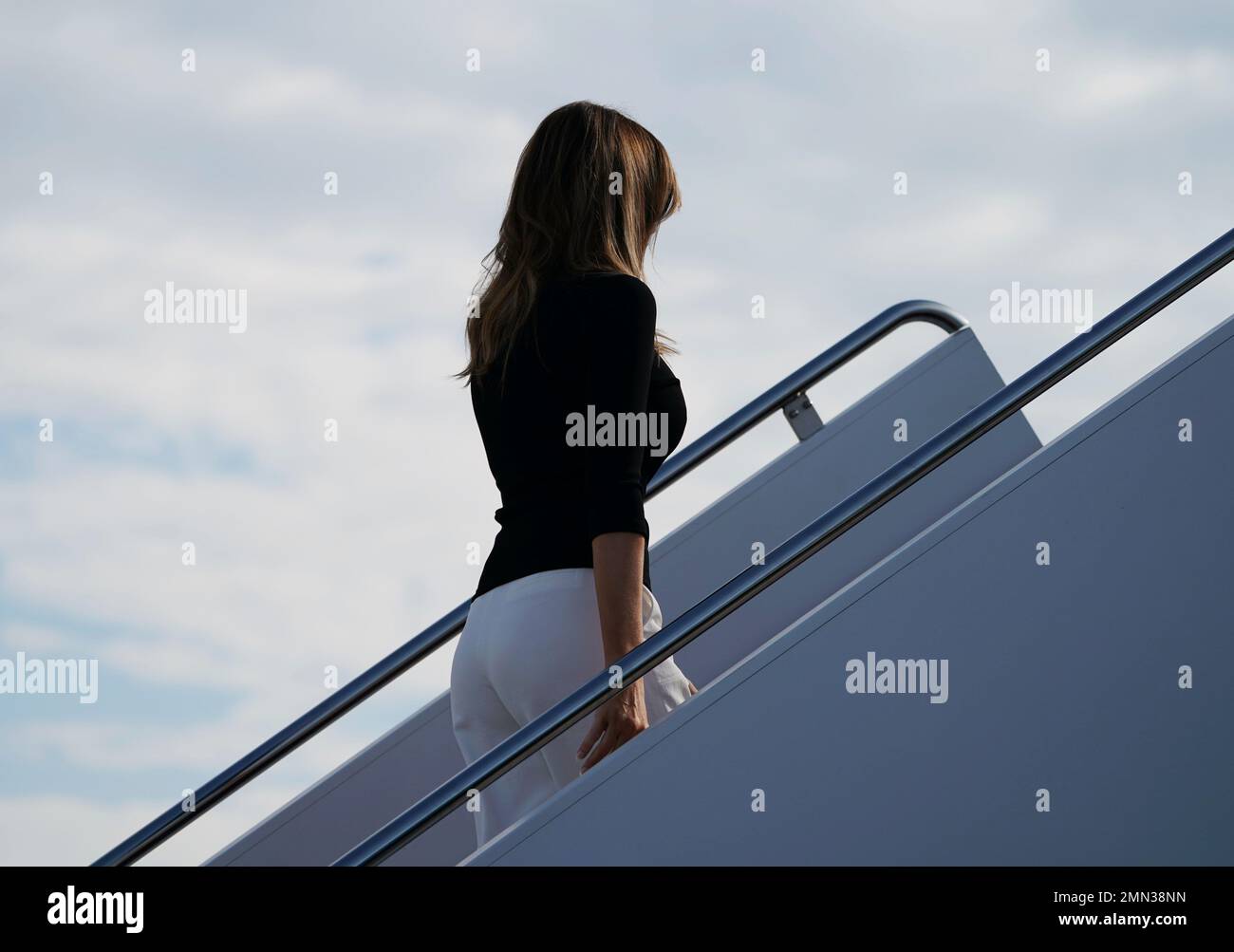 First lady Melania Trump boards an airplane at Andrews Air Force Base ...