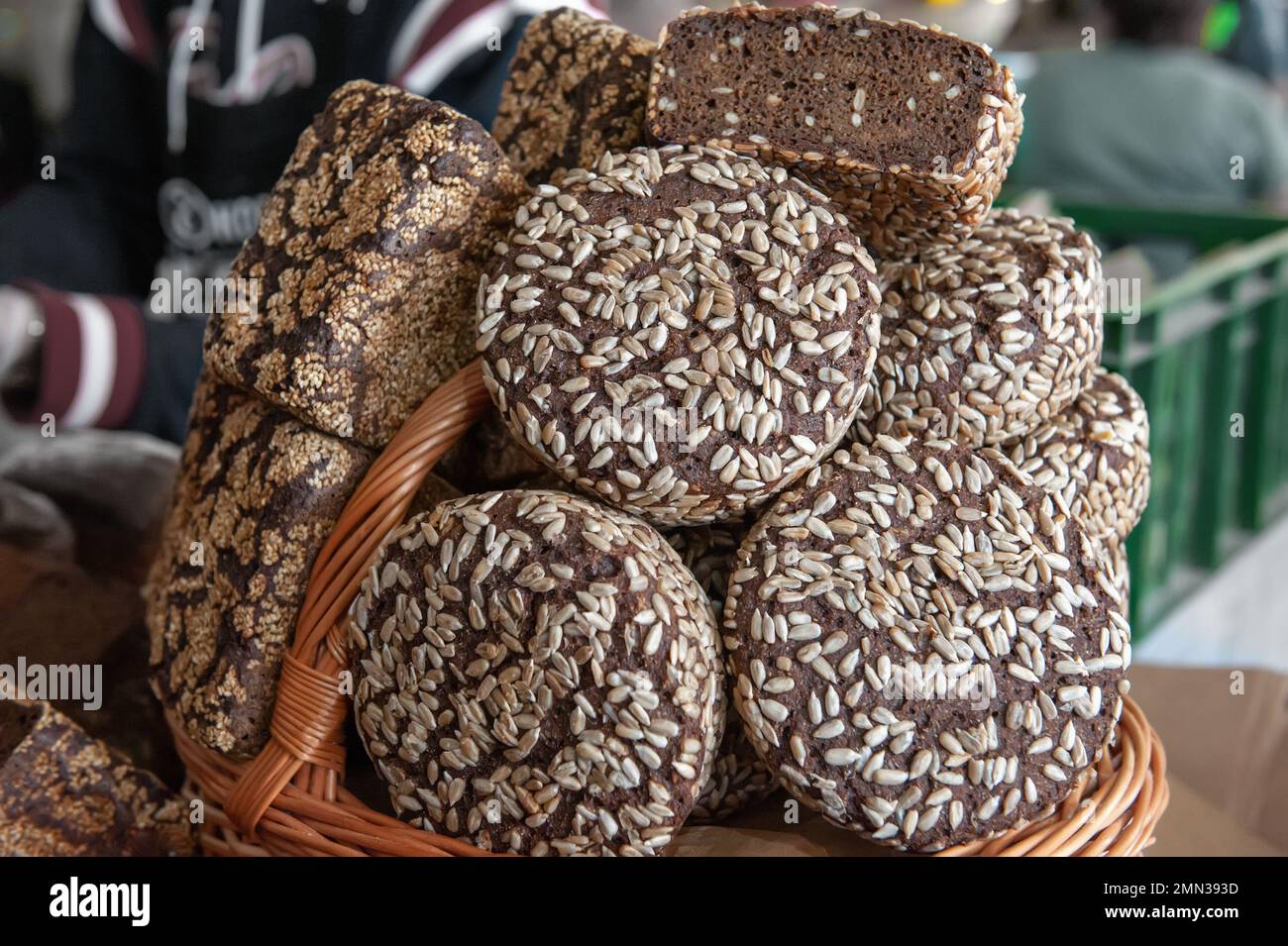 Rye sourdough bread with sunflower seeds on the counter. Bulging round ...