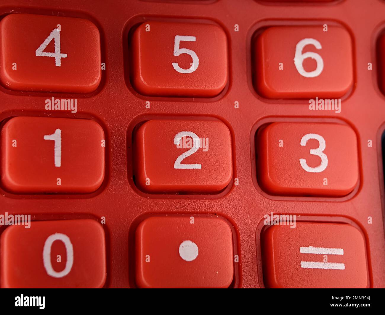Close-up of number on a red calculator. Background and textured Stock ...