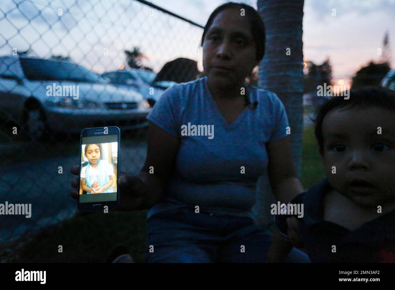 Sitting with her son, Pedro, Buena Ventura Martin Godinez, from ...