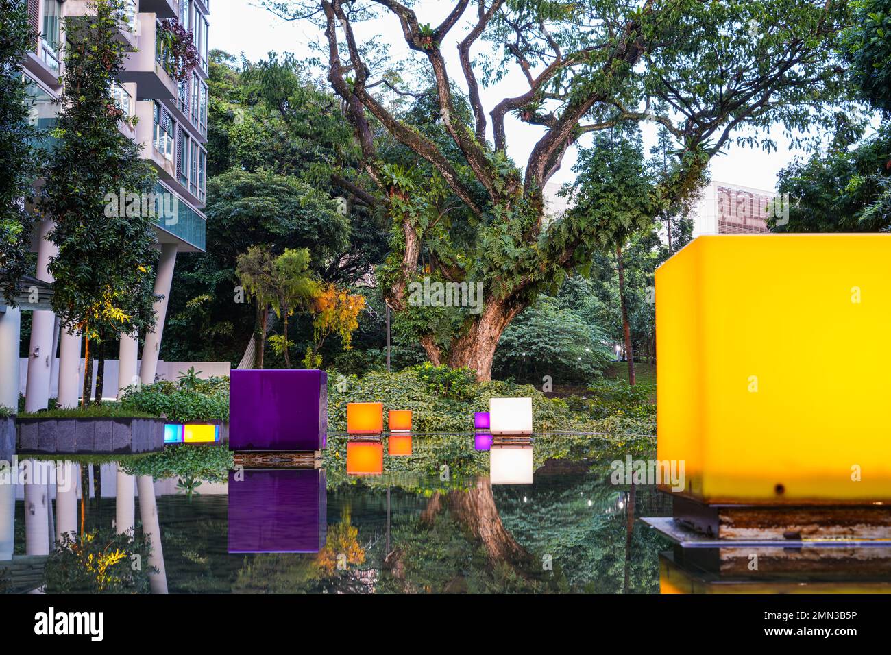 Reflections of trees and cube water features at Commercial Areas Stock ...