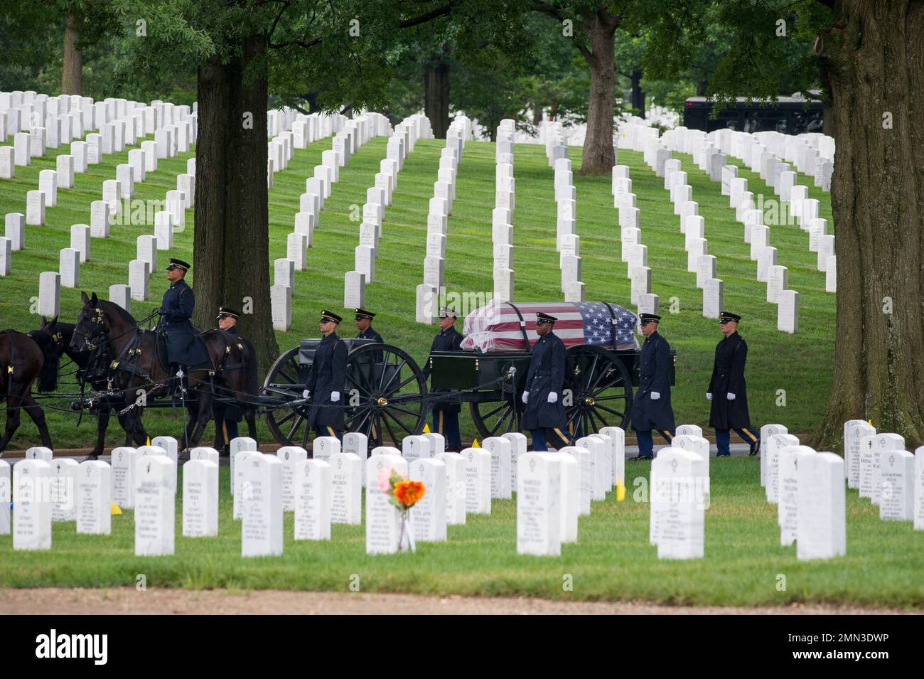 A caisson carries the casket containing the remains of five Army Air ...
