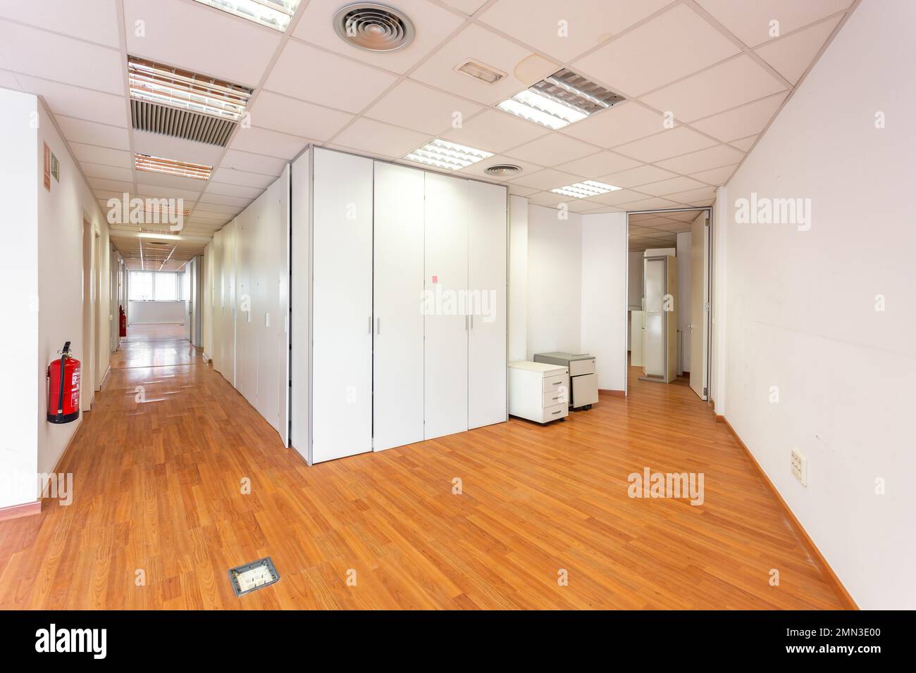 Empty abandoned room with white and wooden office lockers to store ...