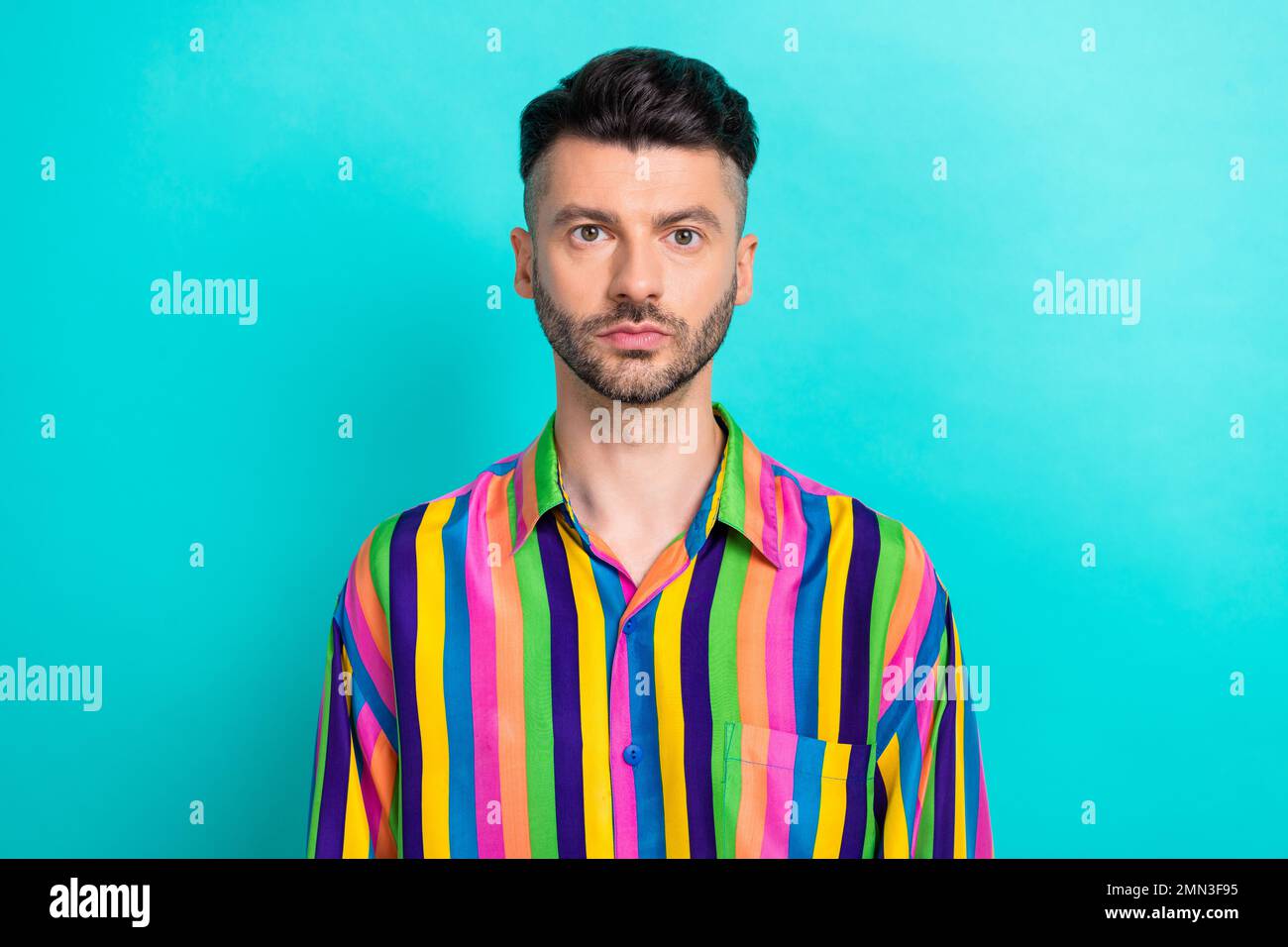 Portrait of serious good mood guy with brunet haircut wear colorful ...