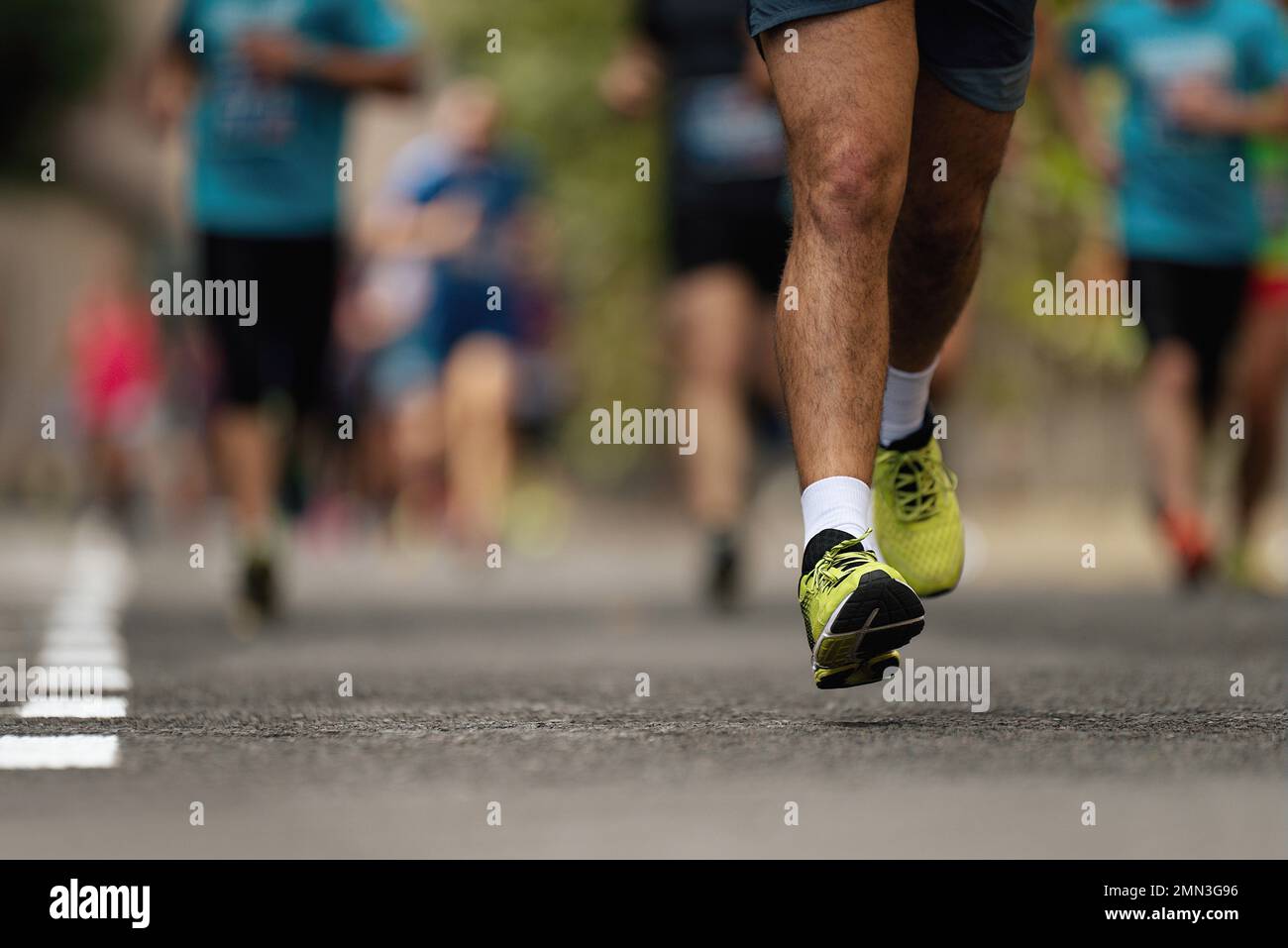 Marathon running race, people feet on city road Stock Photo - Alamy
