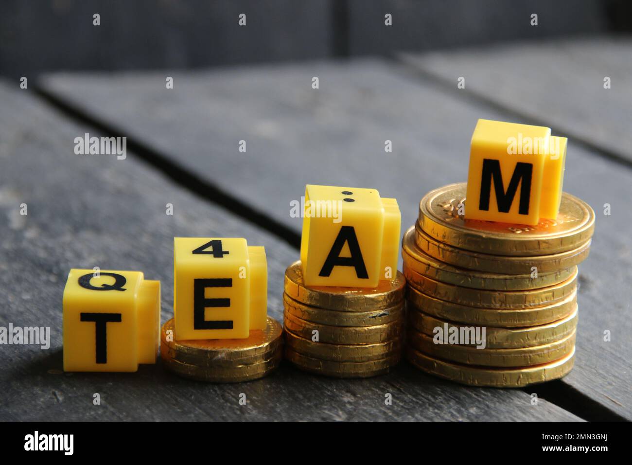 Team creative concept Golden coins on vintage background Stock Photo ...