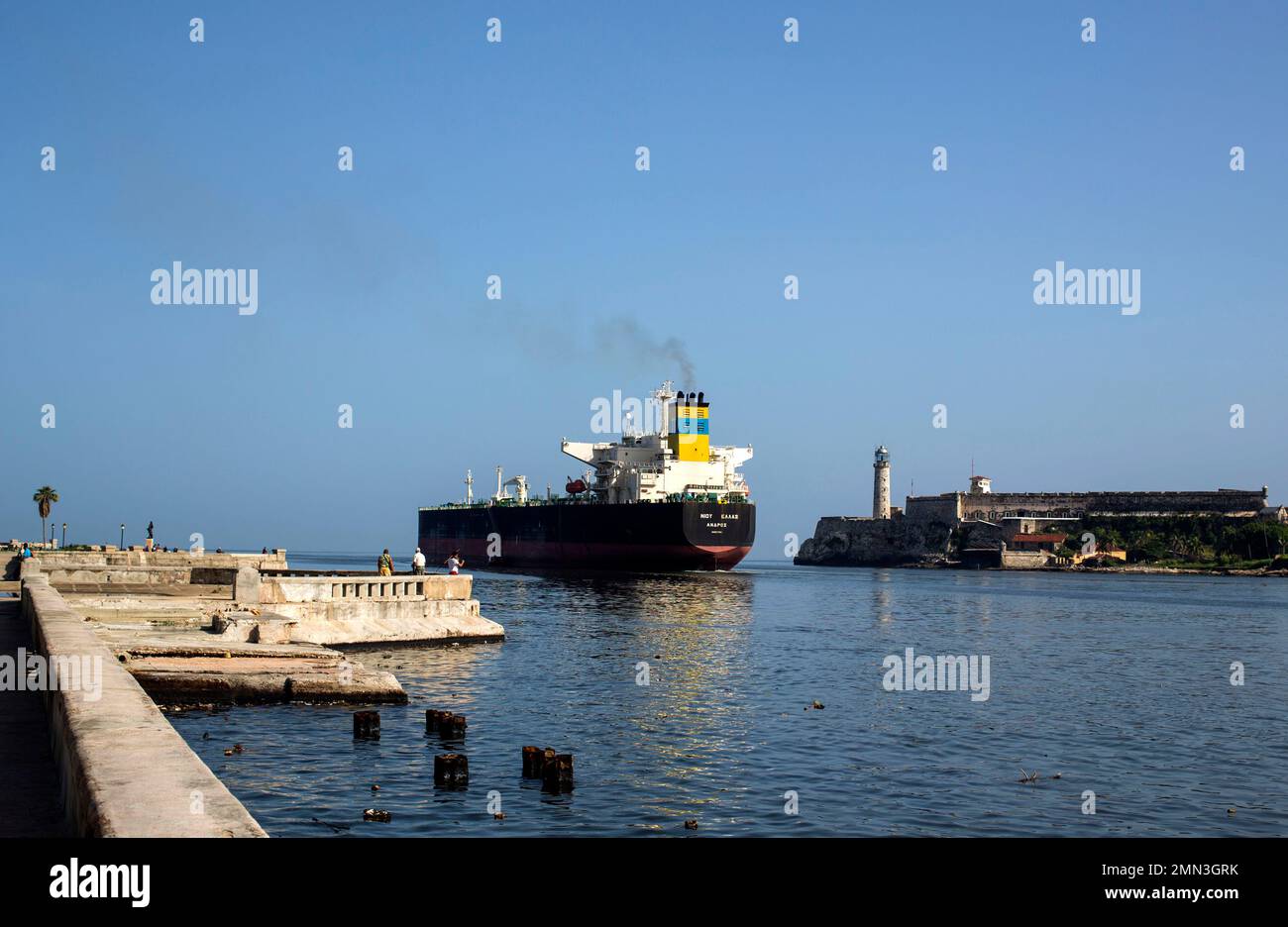 Flying a Greek flag, crude oil tanker New Hellas leaves the port after ...