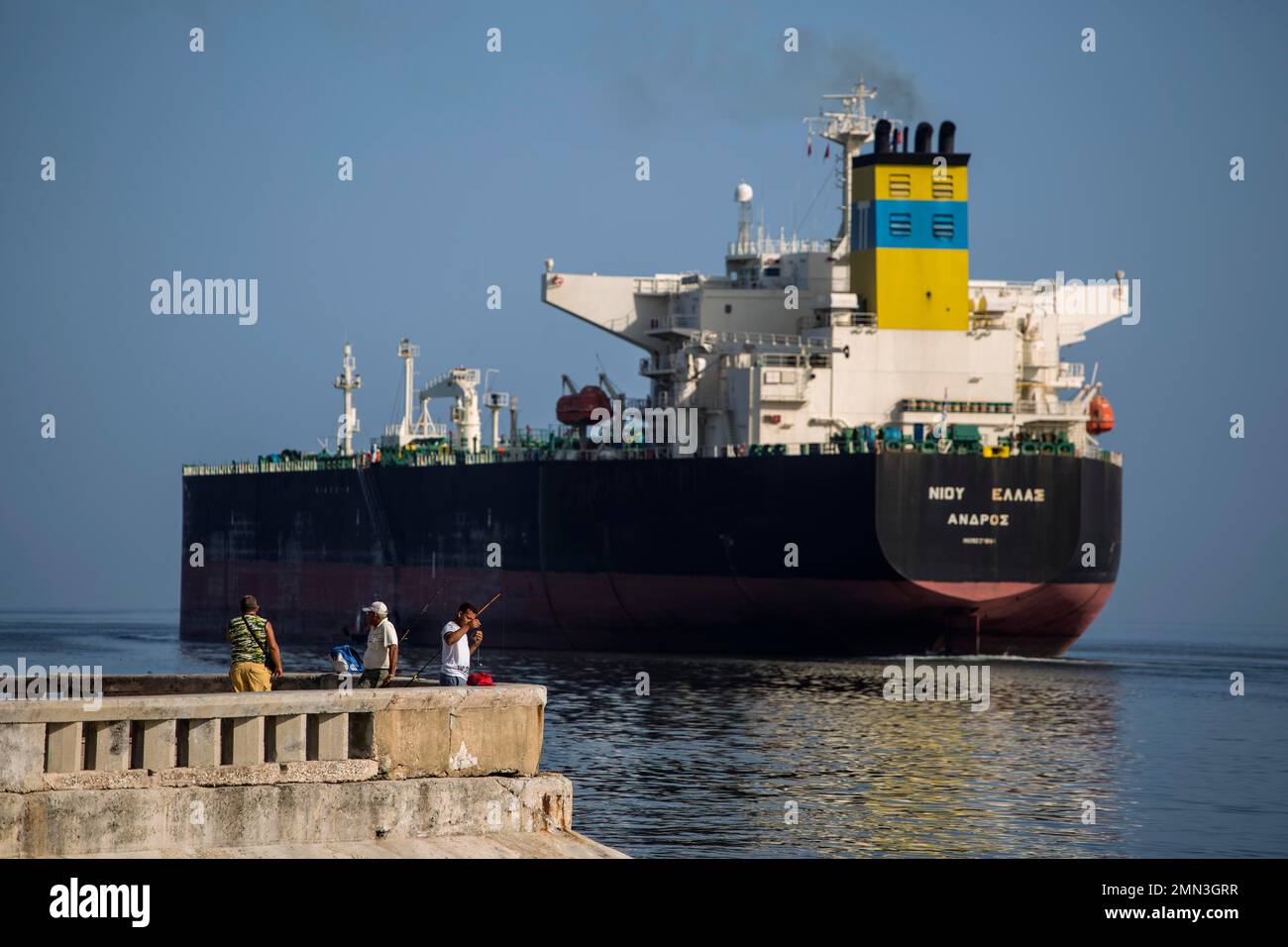 Flying a Greek flag, crude oil tanker New Hellas leaves the port after ...