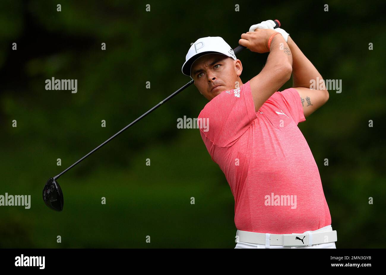 Rickie Fowler watches his tee shot on the seventh hole during the ...