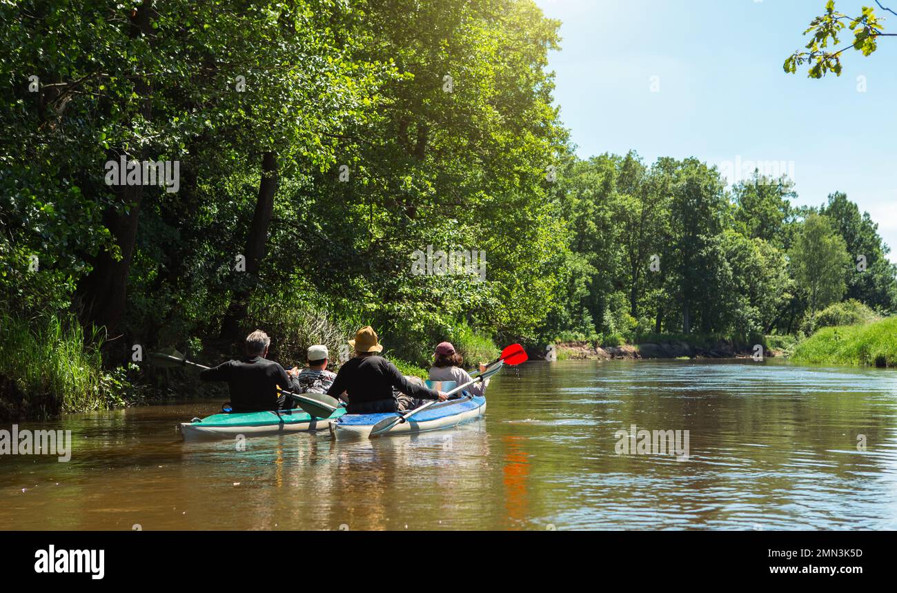 Family kayak trip. Man and woman and elderly couple senior and seniora ...