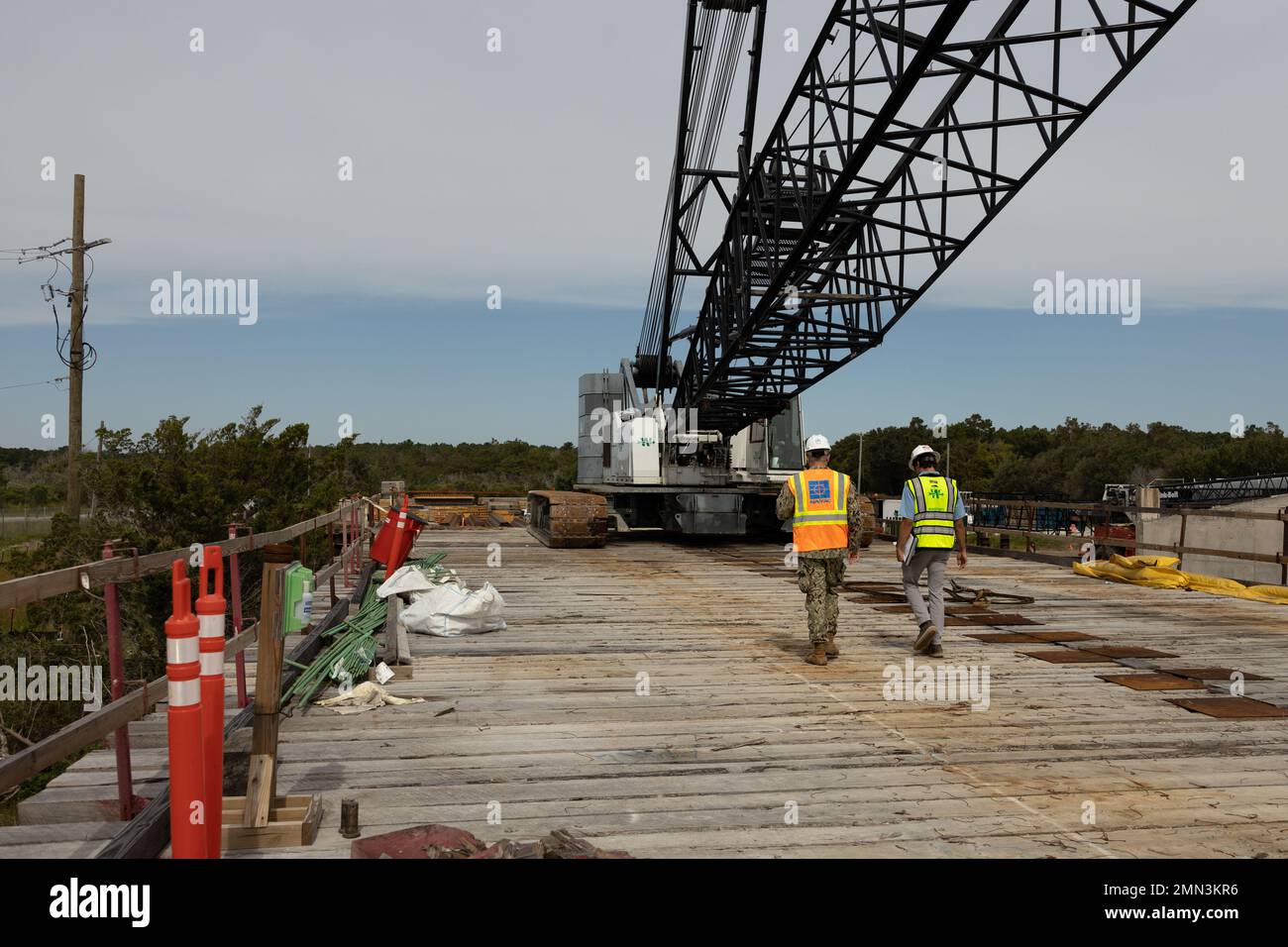 U.S. Navy Lt. Will Cornett, left, a construction manager with Naval ...