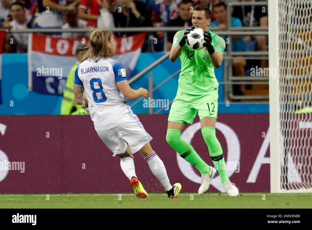 Croatia goalkeeper Lovre Kalinic, right, holds the ball as Iceland's ...