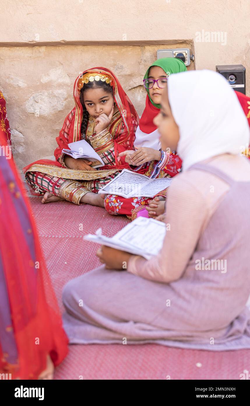 Nizwa, Oman, 2nd December 2022: omani girls reciting a Holy Book Stock ...