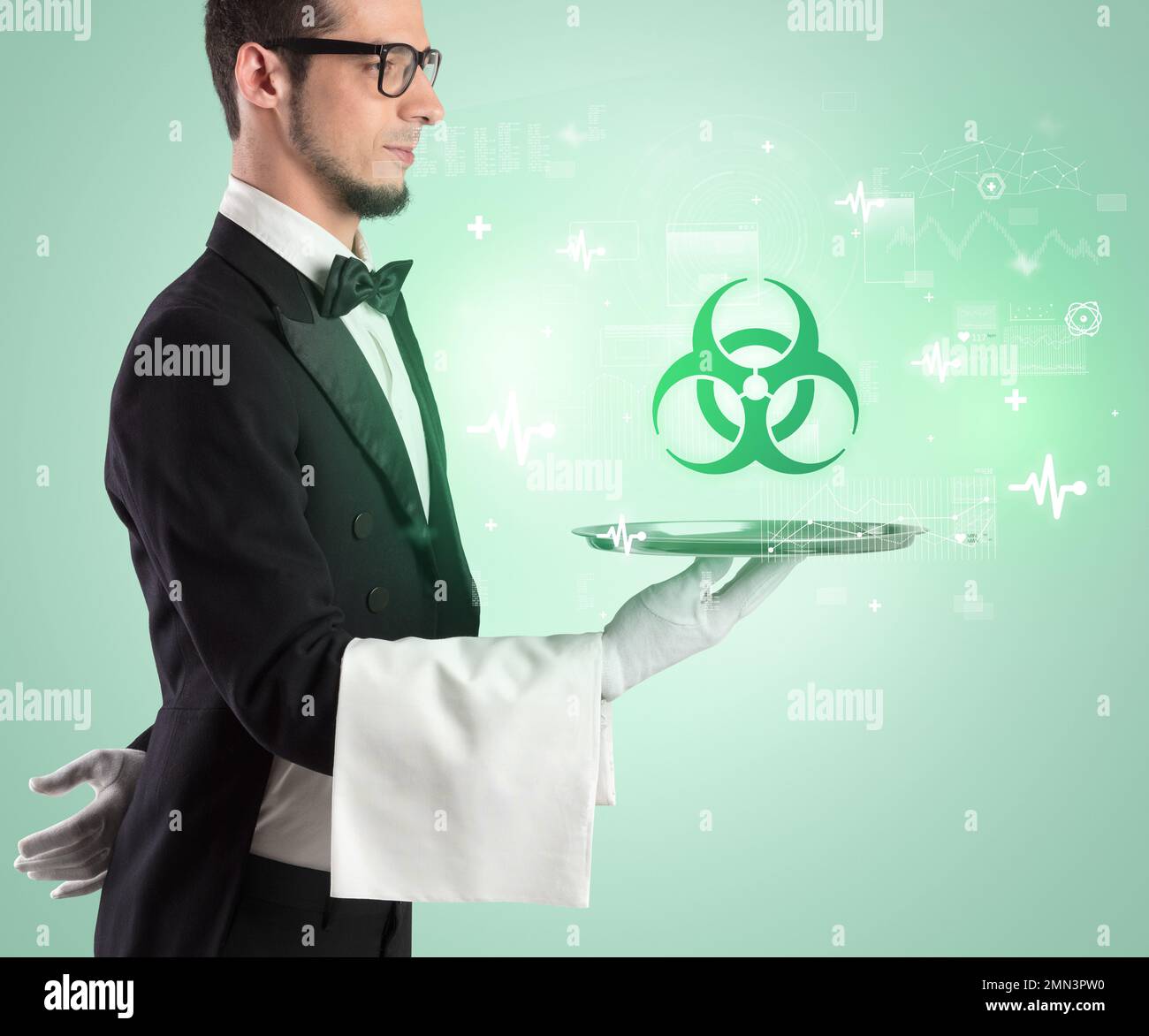 Handsome young waiter in tuxedo holding healthcare icons on tray Stock ...