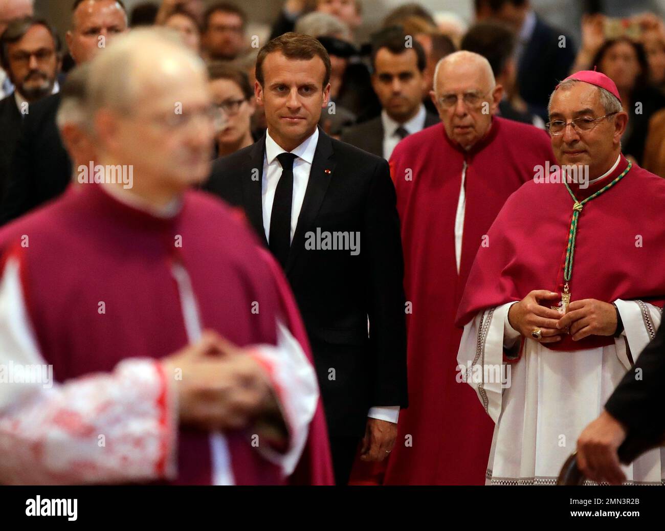 French President Emmanuel Macron is flanked by Vicar General of Rome ...