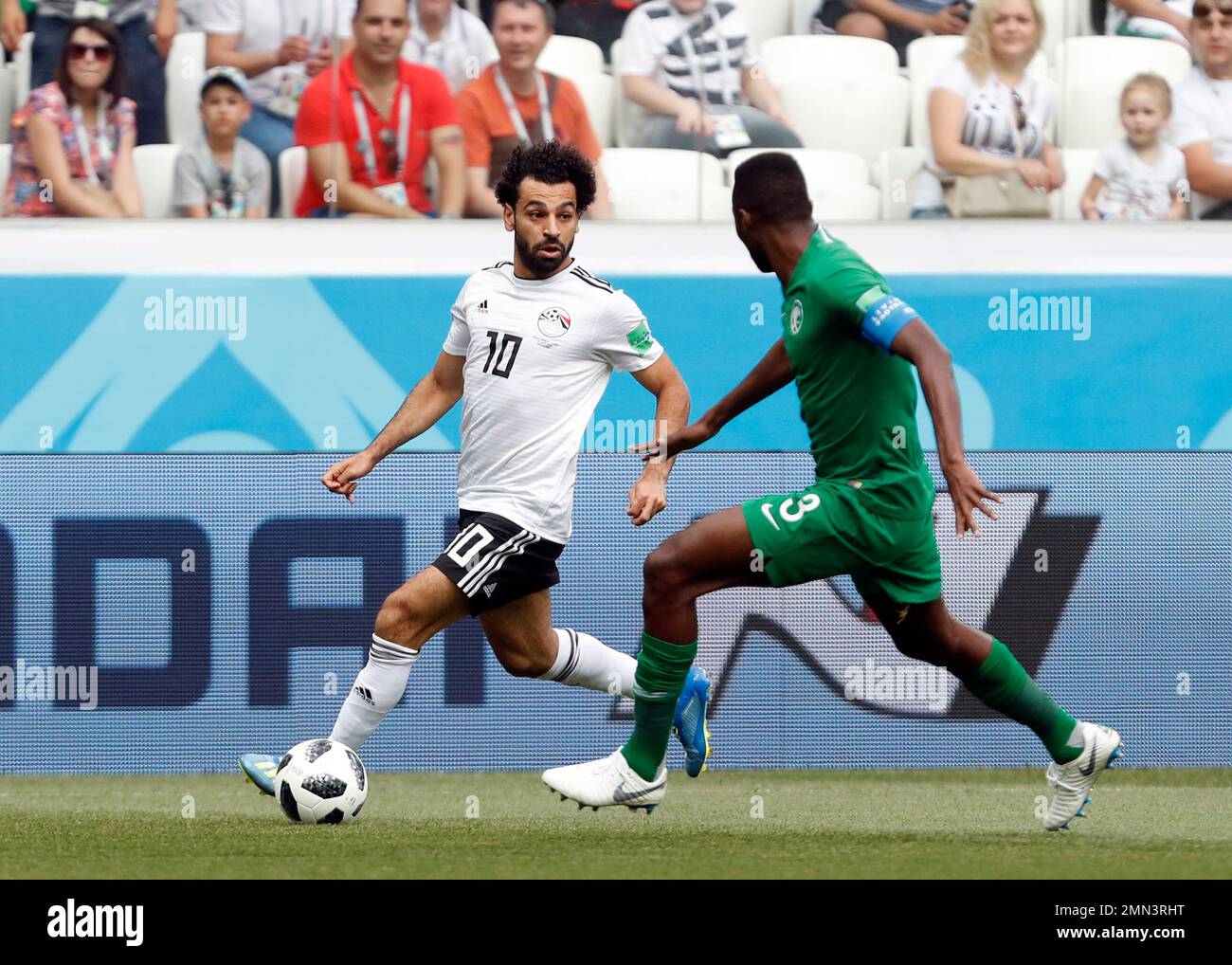 Egypt's Mohamed Salah, left, duels for the ball with Saudi Arabia's ...