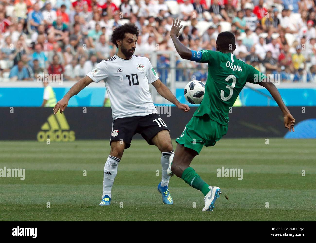 Egypt's Mohamed Salah, left, duels for the ball with Saudi Arabia's ...