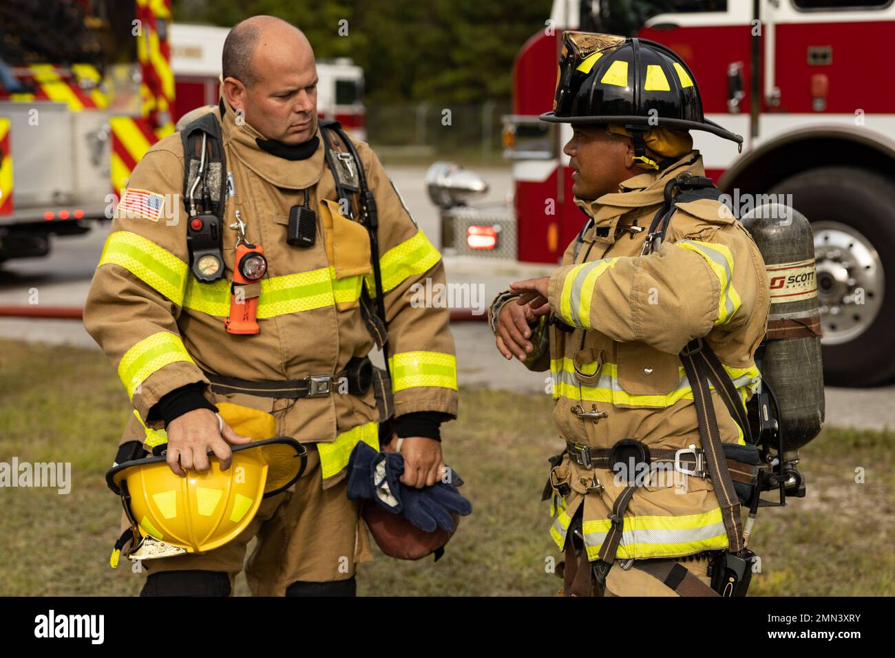 Michael Damren, left, a firefighter/paramedic, and Lt. Preston Guidry ...