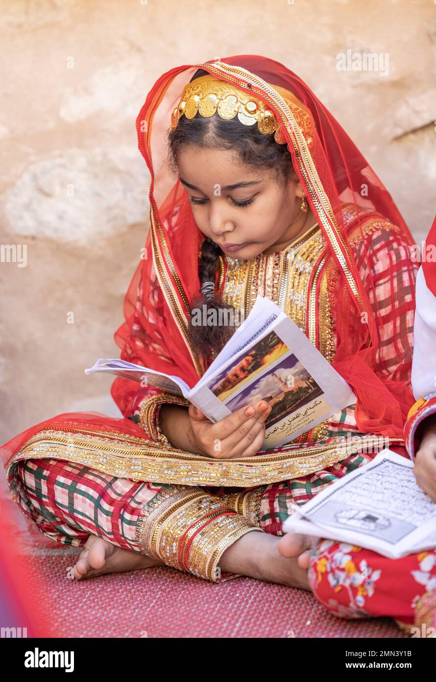 Nizwa, Oman, 2nd December 2022: omani girls reciting a Holy Book Stock ...