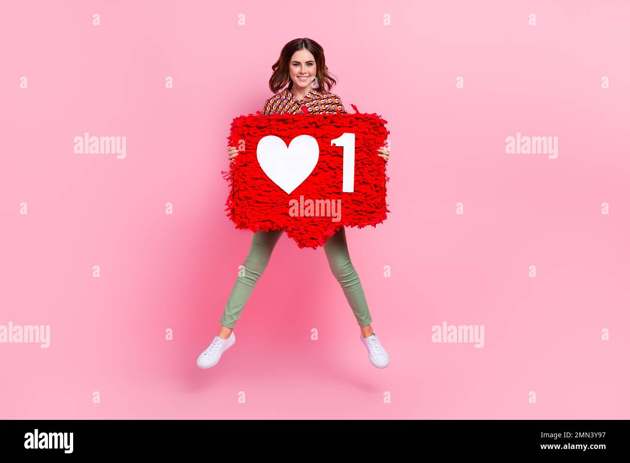 Full size portrait of cheerful energetic girl jumping hands hold big ...