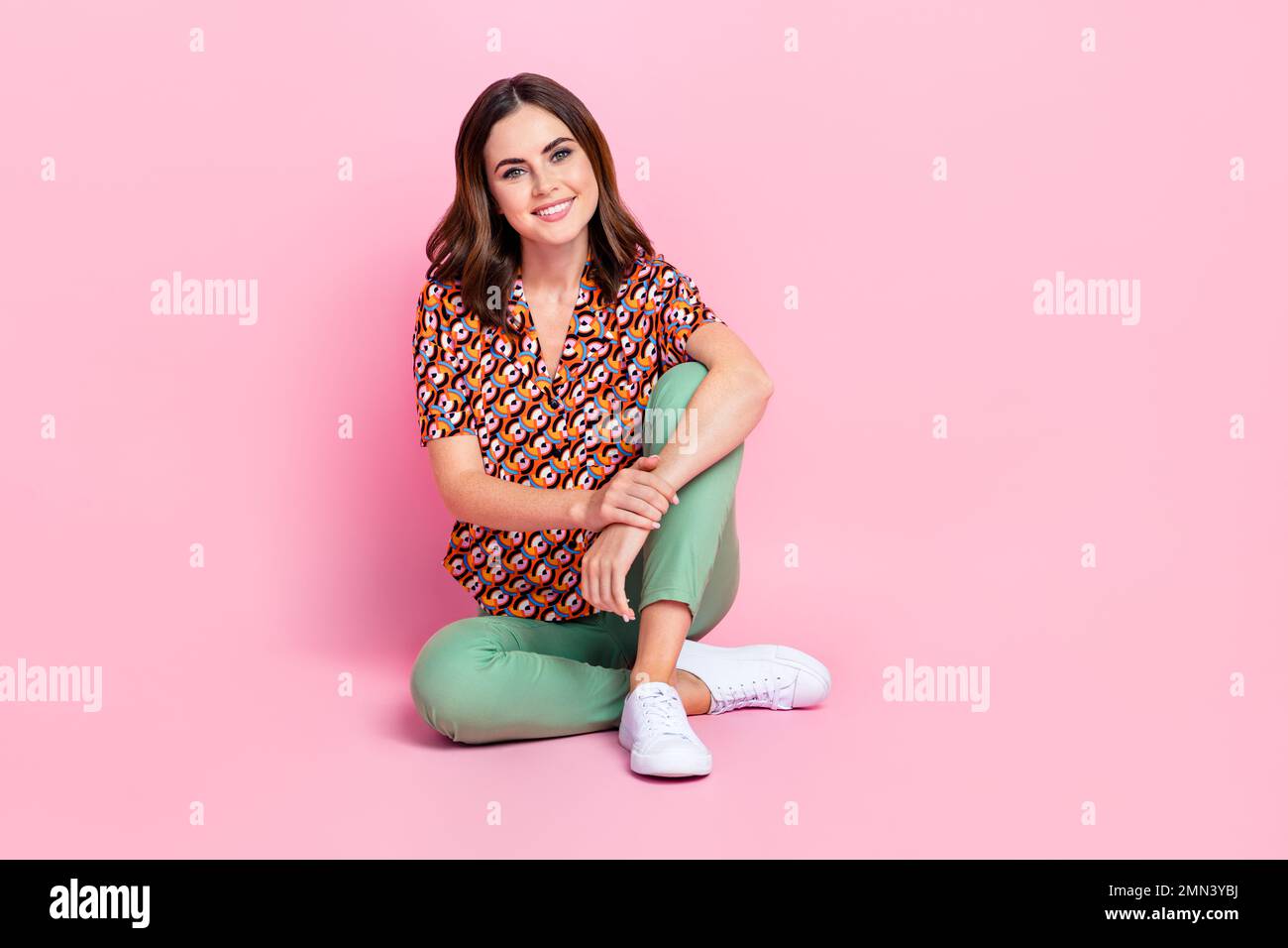 Full body portrait of adorable satisfied lady sit floor empty space ...