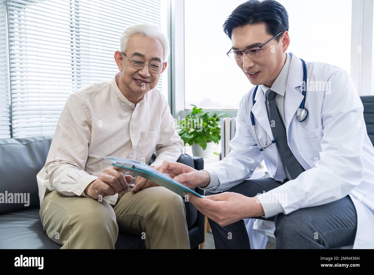 Older men and family doctor Stock Photo - Alamy