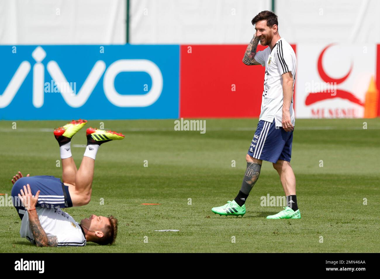 Lionel Messi, ,right, laughs as Lucas Biglia falls during a training ...