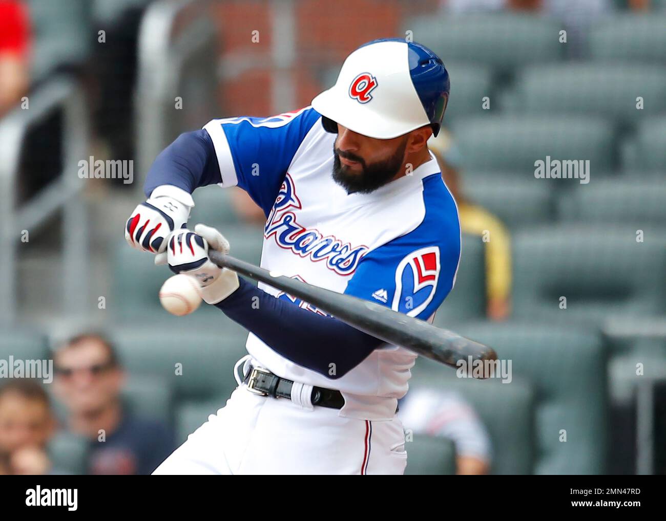 Atlanta Braves Nick Markakis hits a single bringing in a run in the ...