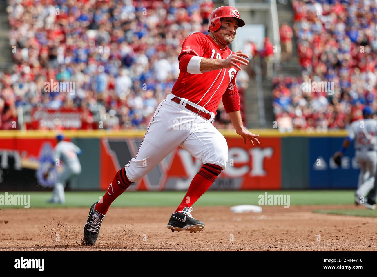 Cincinnati Reds' Joey Votto runs home to score on an RBI-double by ...