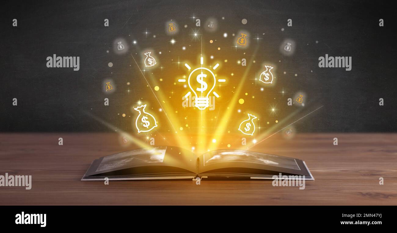 Open book with currency icons above Stock Photo - Alamy