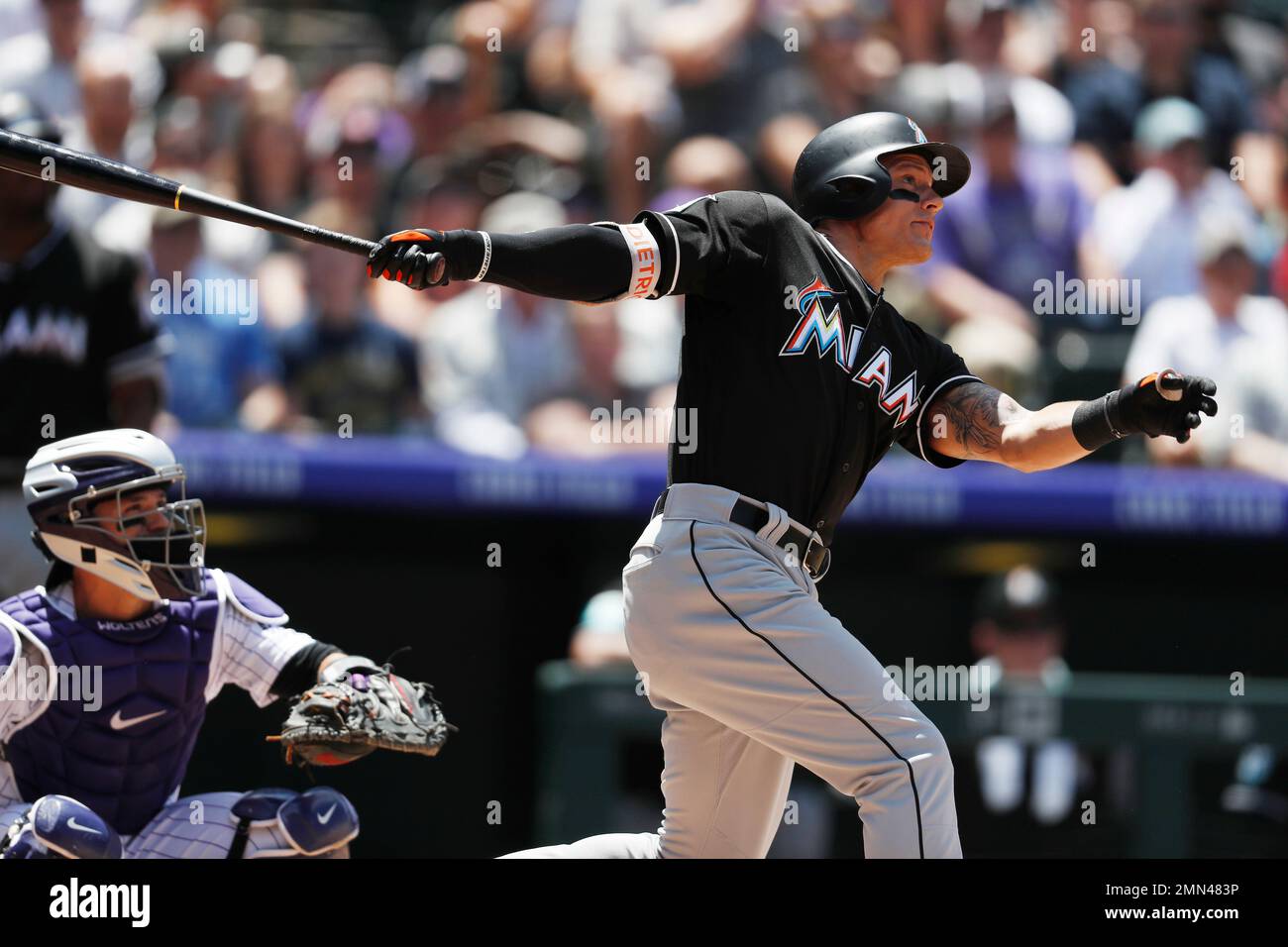 Miami Marlins' Derek Dietrich, right, follows the flight of his solo ...