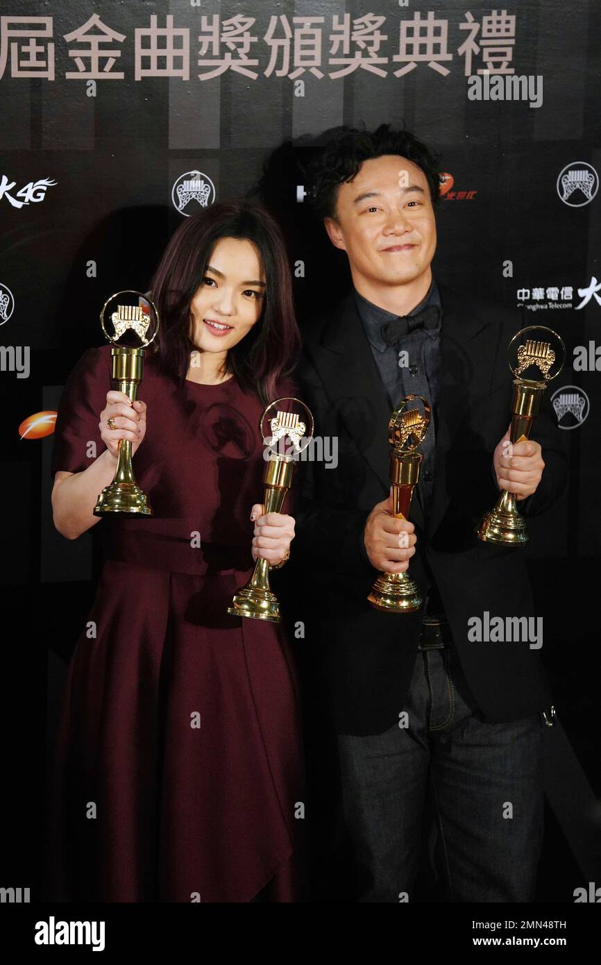 Taiwanese singer Lala Hsu and Hong Kong singer Eason Chan hold their ...