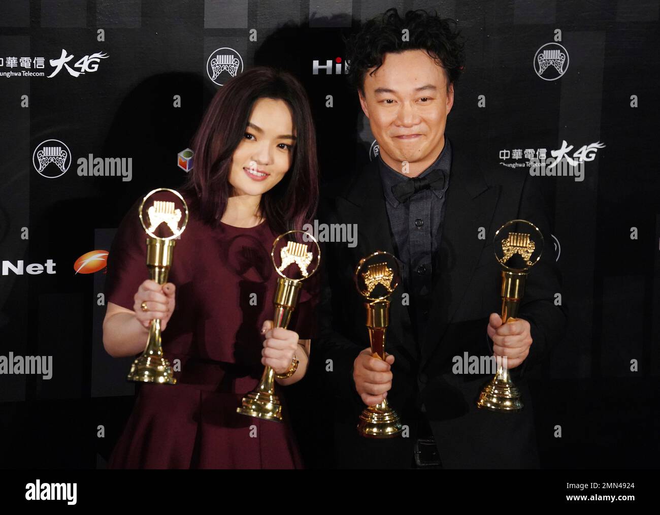 Taiwanese singer Lala Hsu and Hong Kong singer Eason Chan hold their ...