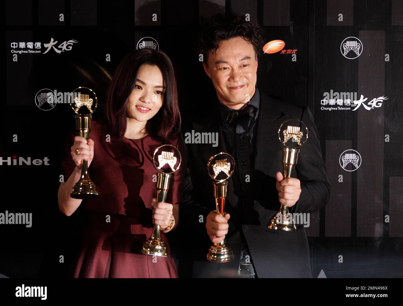 Taiwanese singer Lala Hsu and Hong Kong singer Eason Chan hold their ...