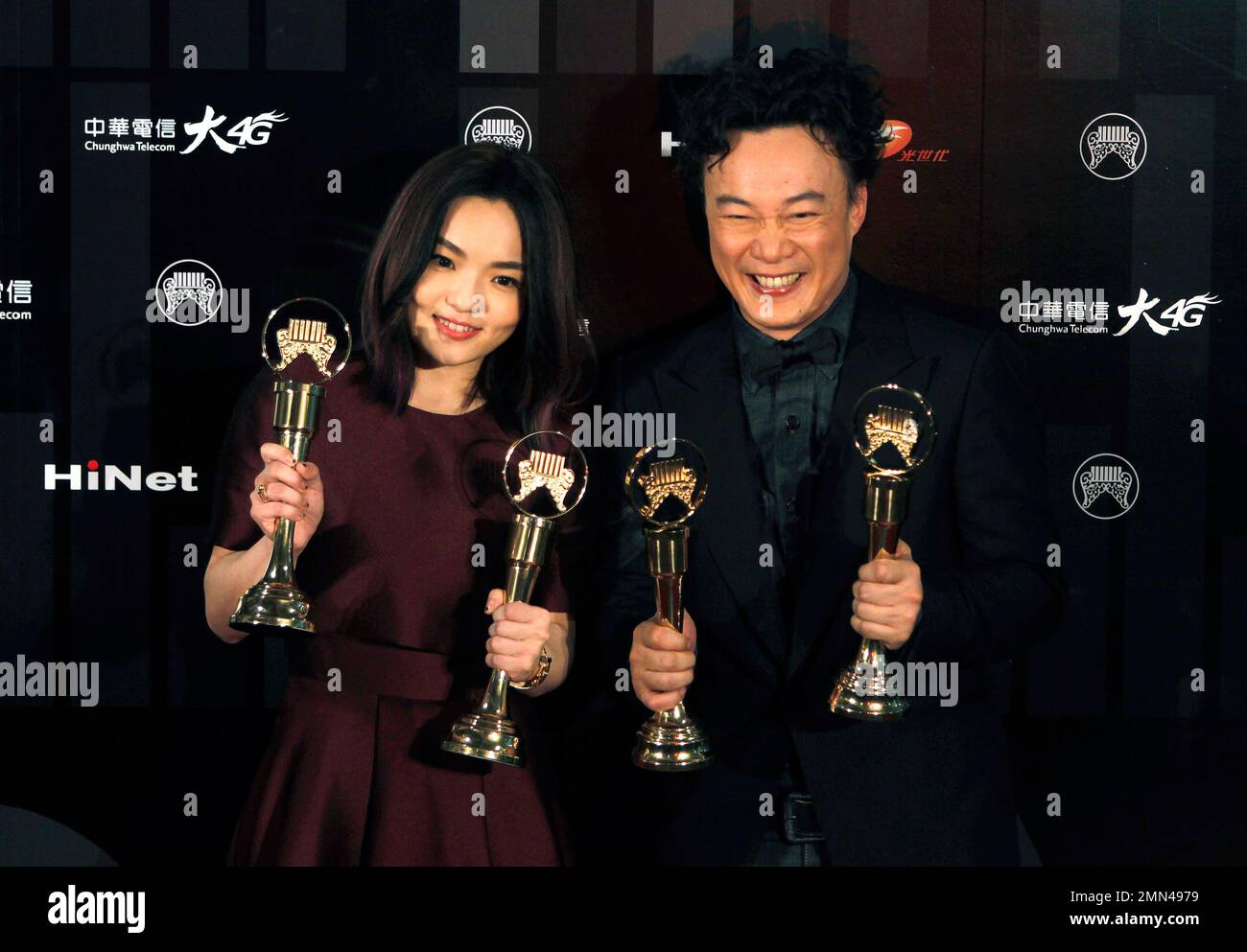 Taiwanese singer Lala Hsu and Hong Kong singer Eason Chan hold their ...