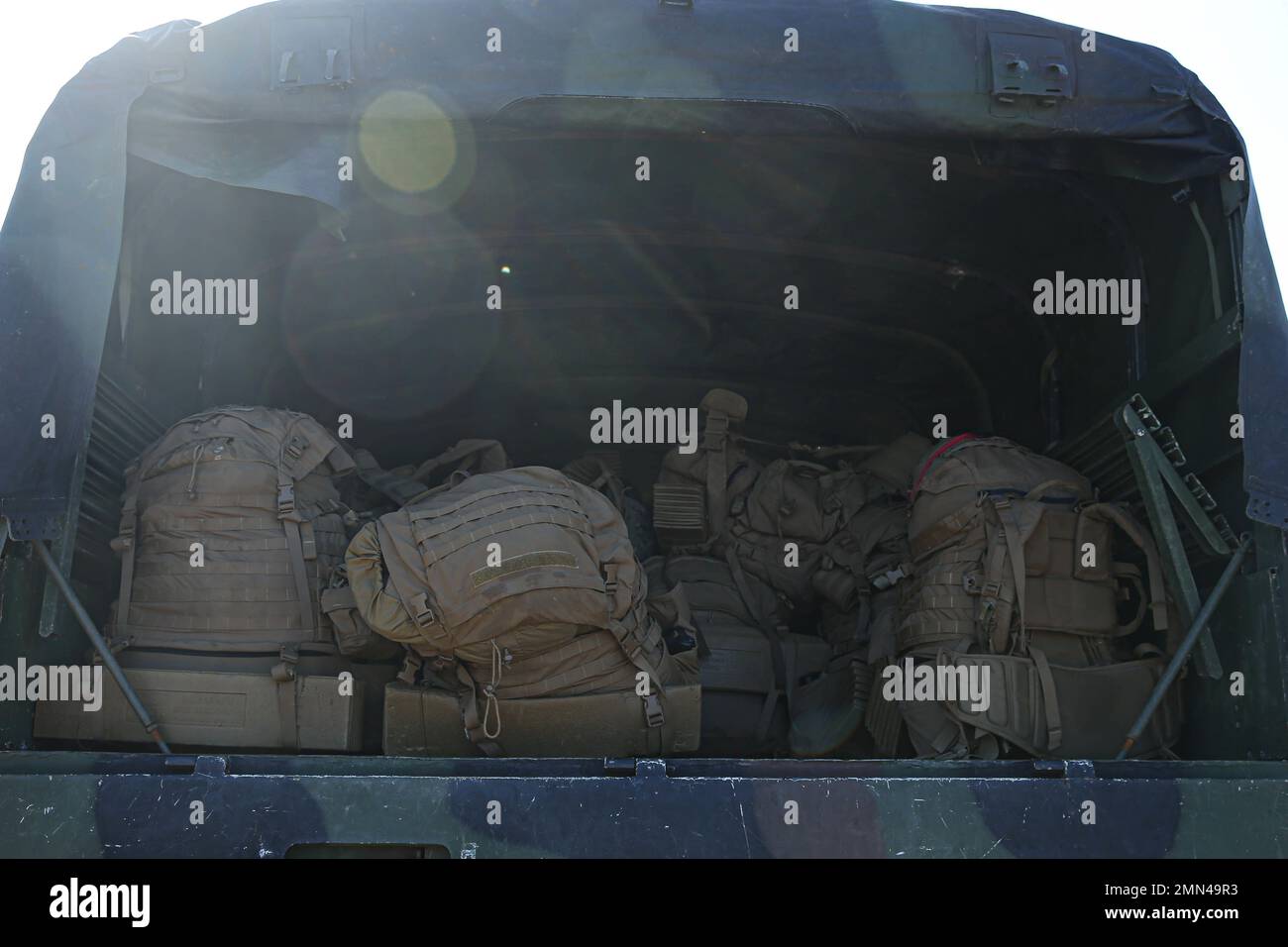 U.S. Marines with 3rd Marine Logistics Group load their gear onto a ...