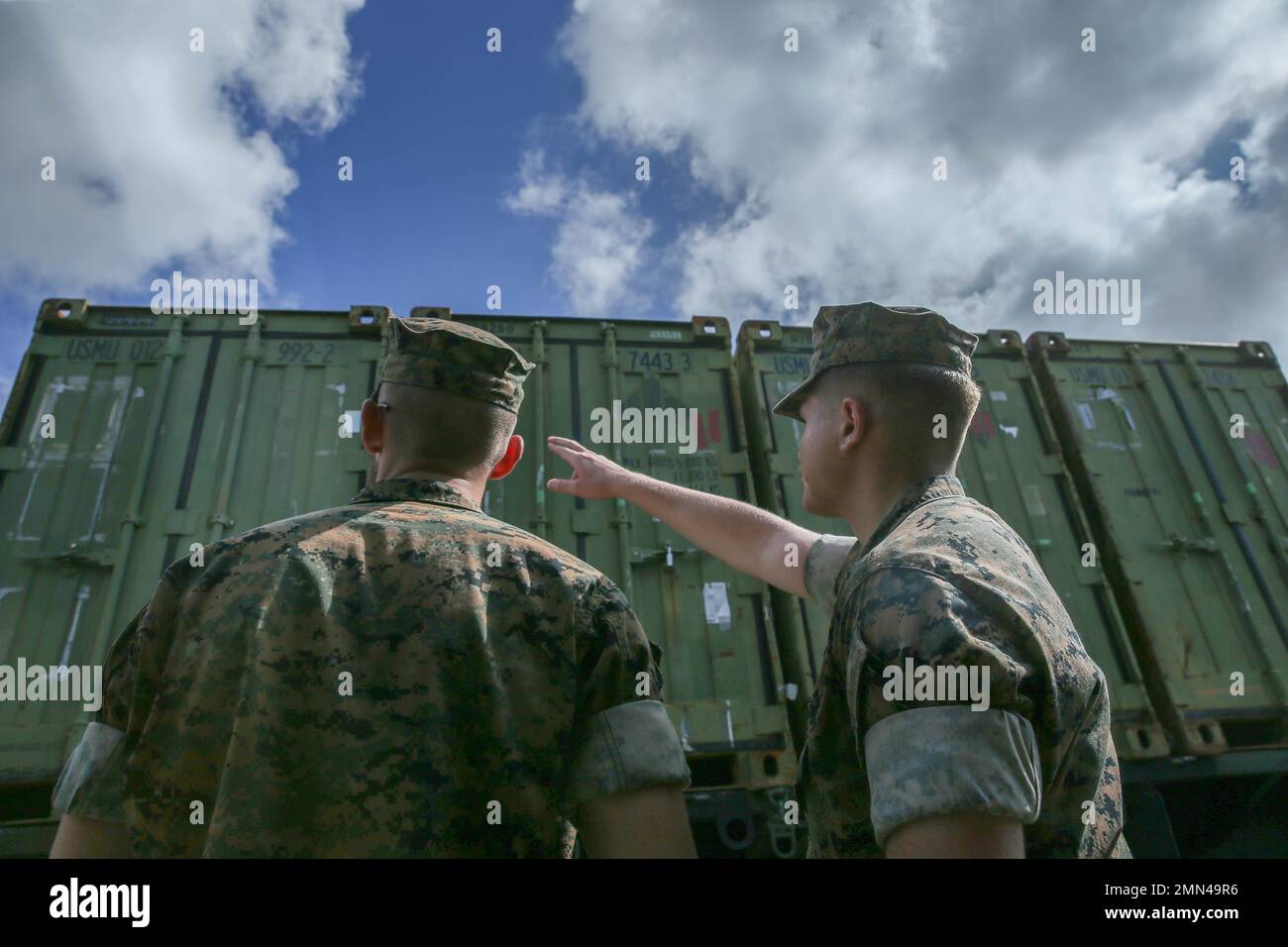 U.S. Marine Corps Lance Cpl. Logan Ivey, left, and Cpl. Riley Litterio ...