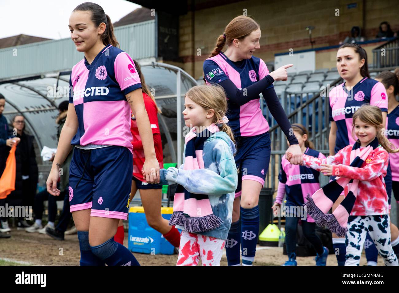 Lily Price and Ceylon Hickman of Dulwich Hamlet FC Women walk out to ...