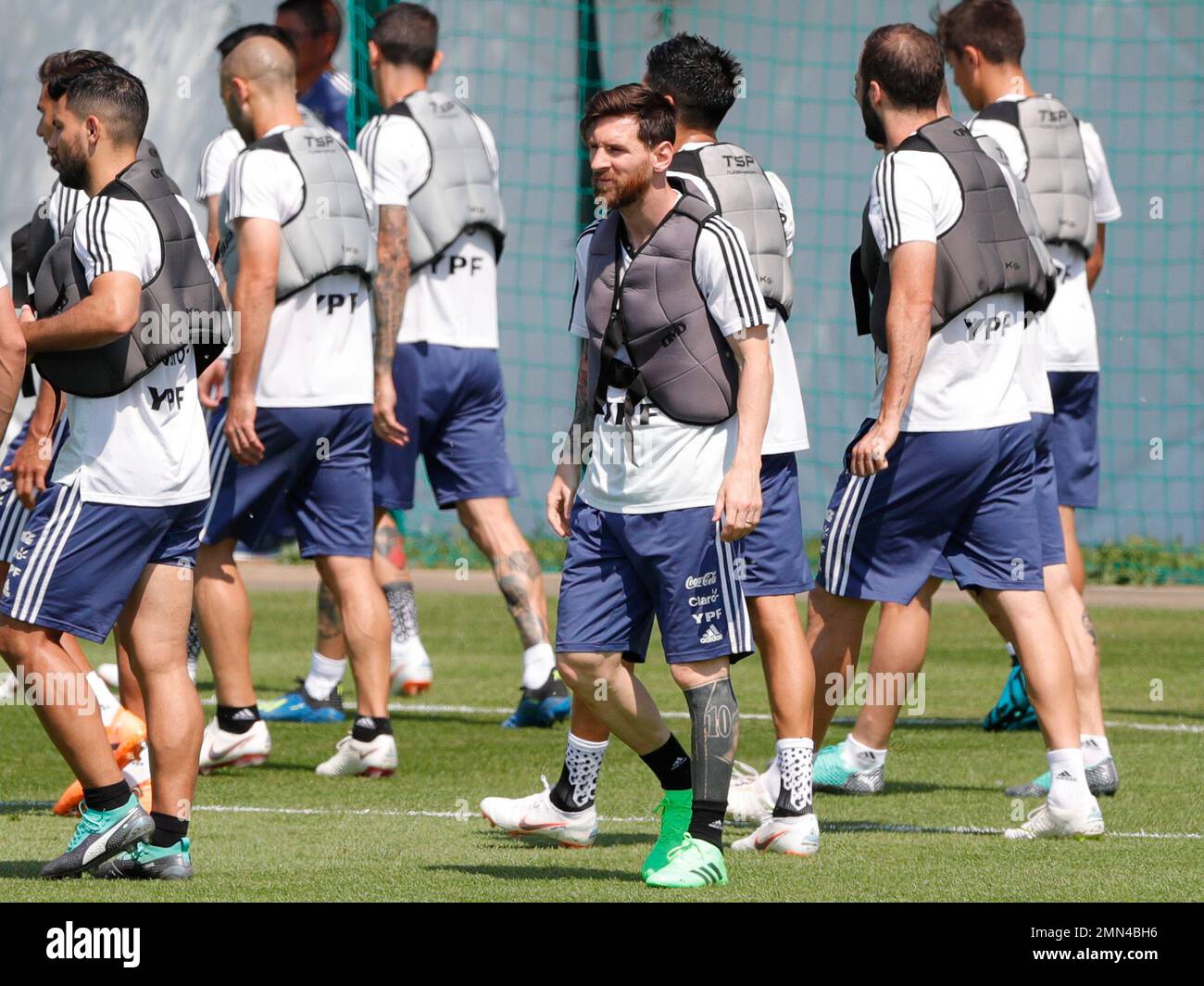 Lionel Messi and teammates work with weight vests during a training ...