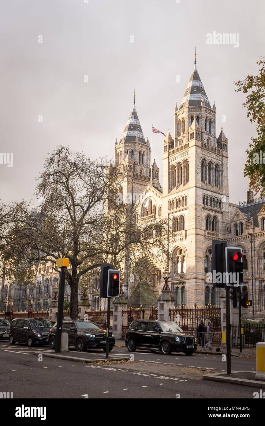 The twin towers of the Natural History Museum lit by the setting sun as ...