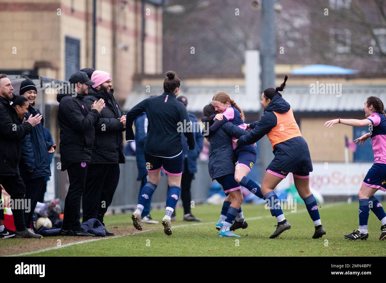 Ceylon Hickman (13 Dulwich Hamlet) celebrates with players on the bench ...