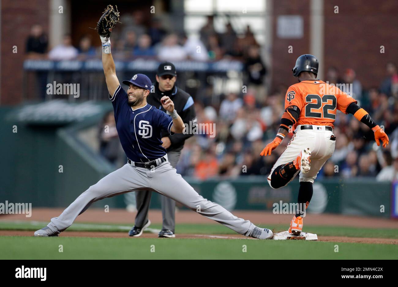 San Diego Padres first baseman Eric Hosmer, left, stretches to put out ...