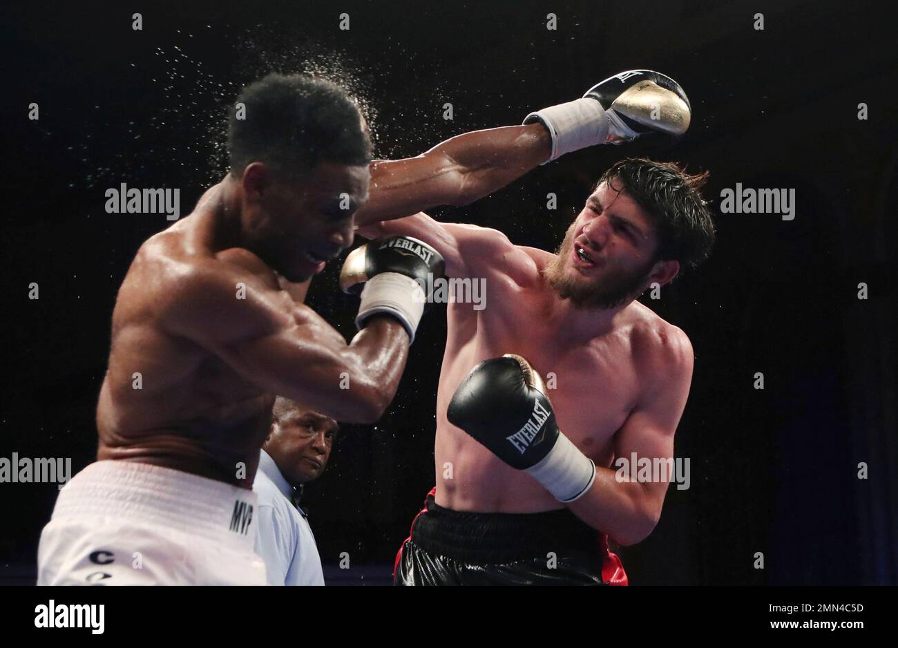 Umar Salamov, right, of Russia, throws a right at Brian Howard during ...
