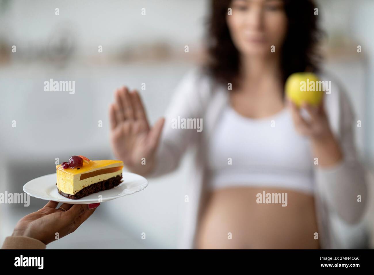 Healthy Eating During Pregnancy. Young Pregnant Female Refusing Cake ...