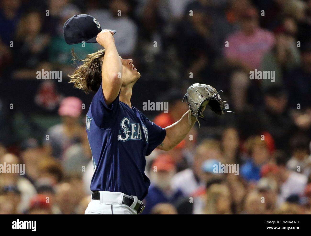 Seattle Mariners relief pitcher Nick Rumbelow reacts after delivering ...